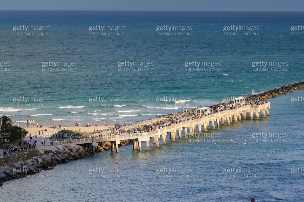 Scenic landscape view of the walkway at South Pointe at the end of ... Scenic landscape view of the walkway at South Pointe at the end of ...
