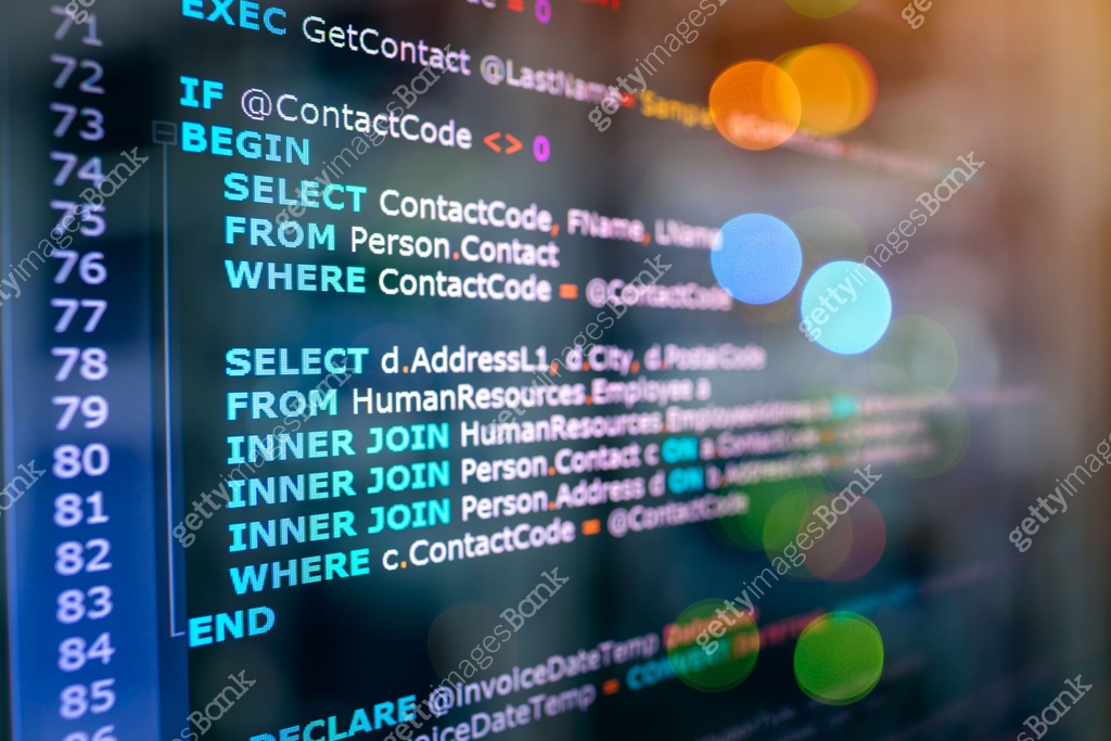 Sql Structured Query Language Code On Computer Monitor And Server