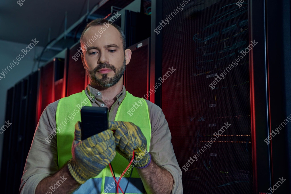 Skilled technician working diligently in a data center while ... Skilled technician working diligently in a data center while ...